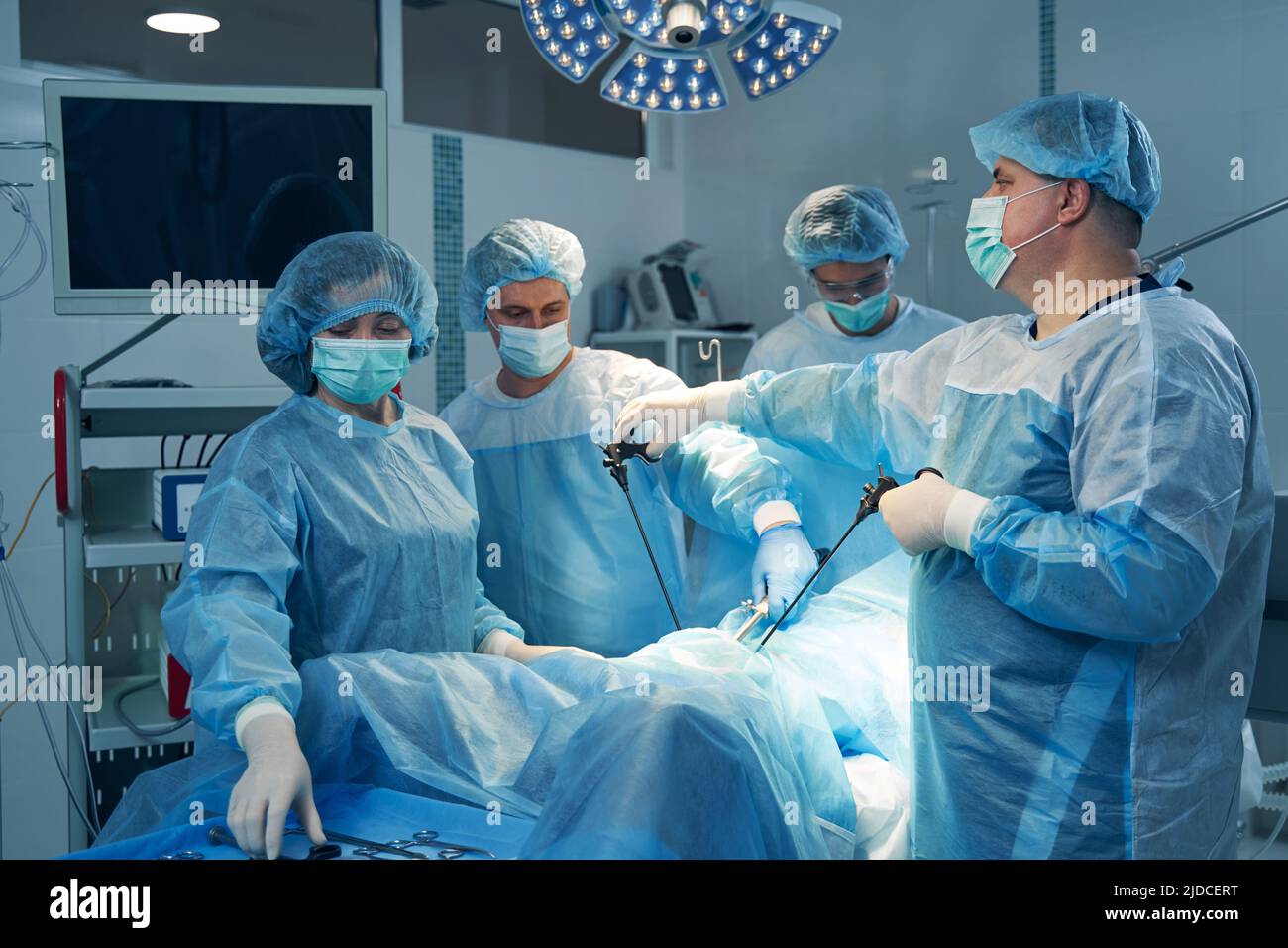 Doctors performing hysteroscopy procedure in the operating room Stock ...