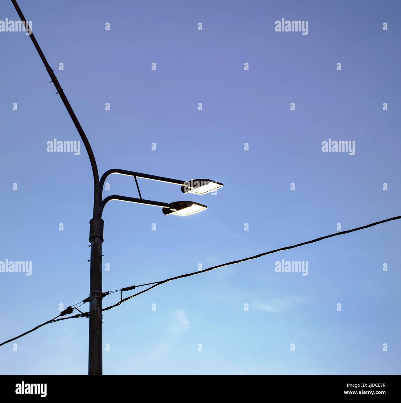 Streetlights on blue sky background Stock Photo - Alamy
