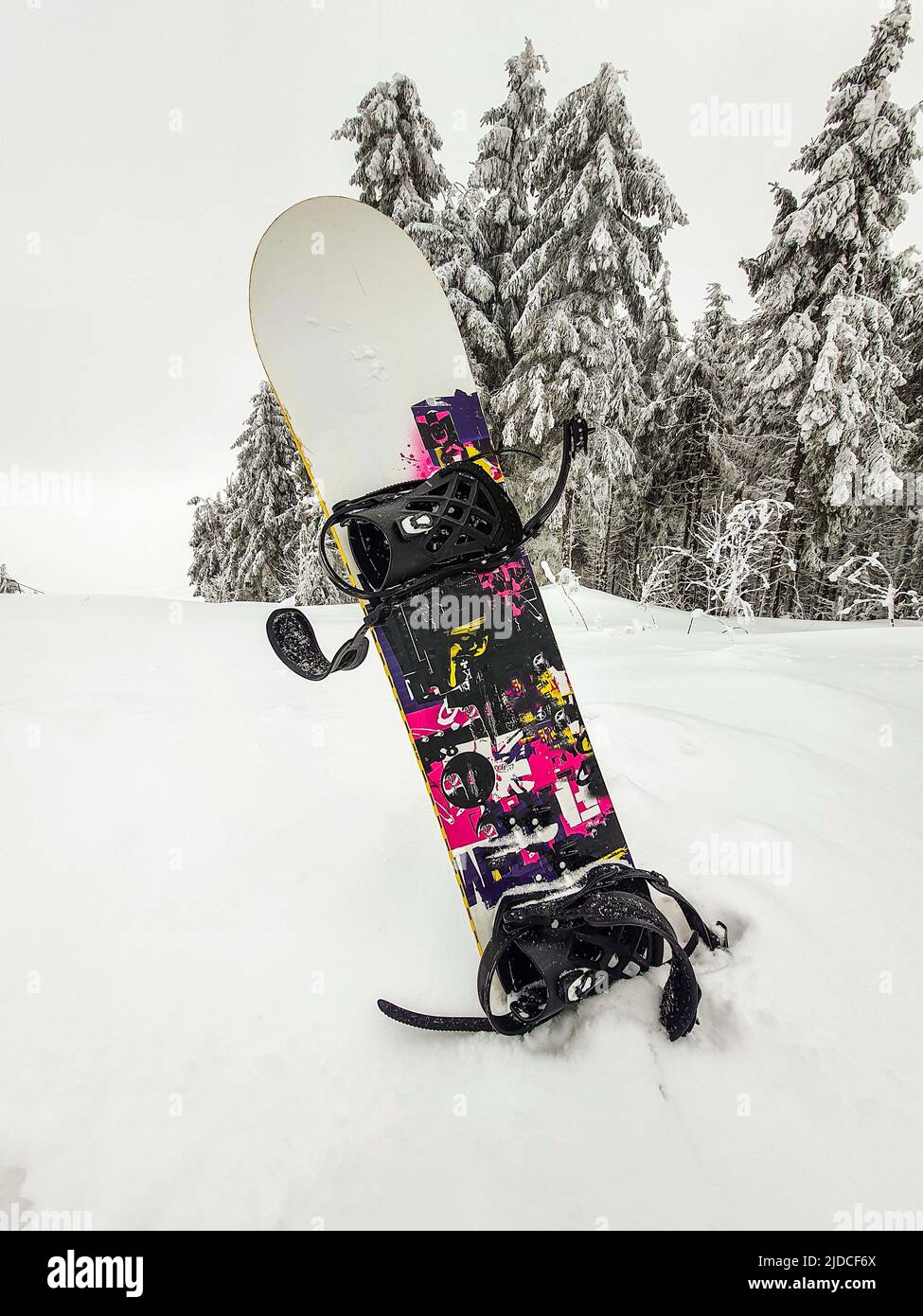 snowboard stick out from the snow ski resort Stock Photo - Alamy
