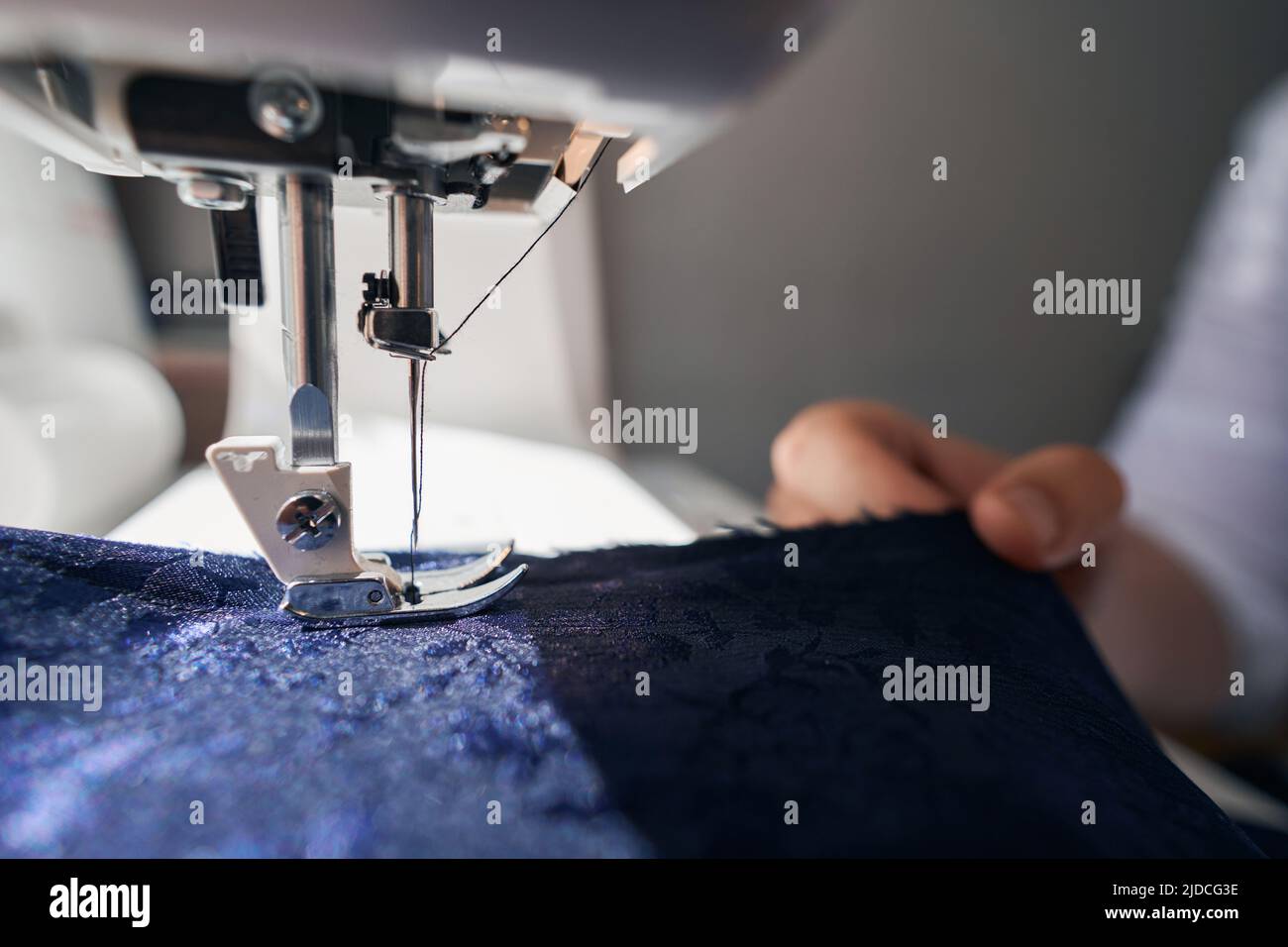 Clothes being made with sewing machine by man Stock Photo - Alamy