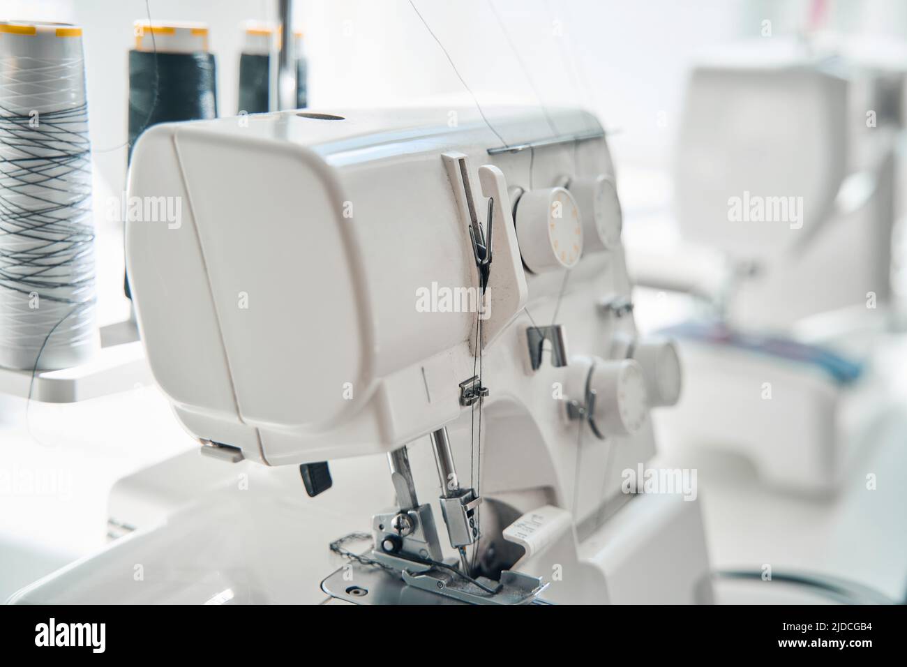 Sewing machine and thread during working process Stock Photo - Alamy