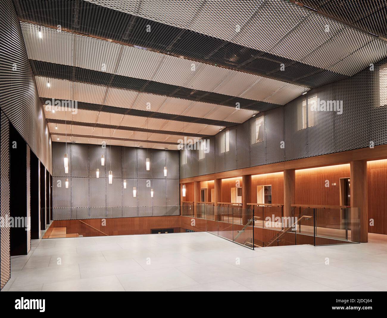 Main atrium with wood panelling and metal mesh panel ceiling and walls ...