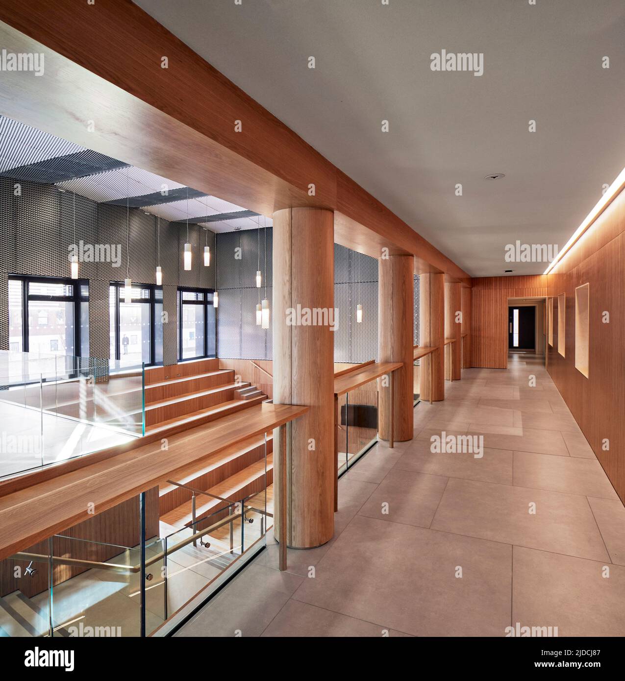 View along the wood clad corridor and informal lecture theatre social ...