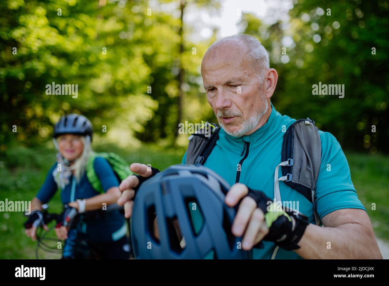 Elderly man riding bicycle bike ride exercise park cycle hi-res stock ...