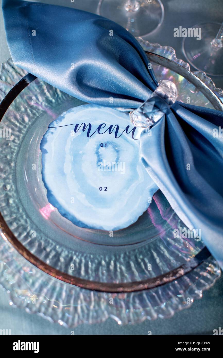 Cards with inscriptions on a plate on a wedding table Stock Photo - Alamy