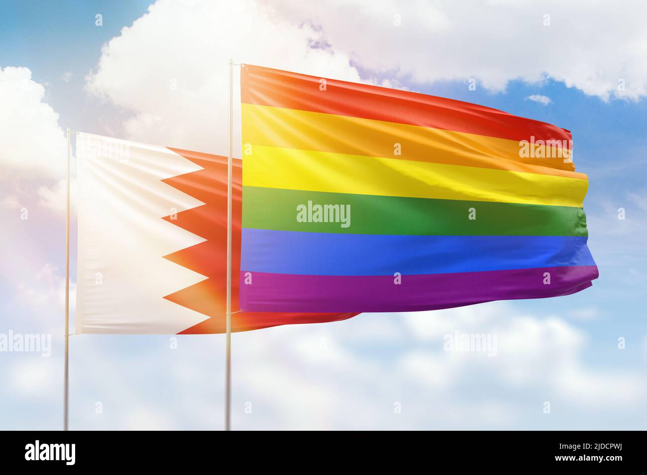 Sunny blue sky and flags of lgbt and bahrain Stock Photo - Alamy