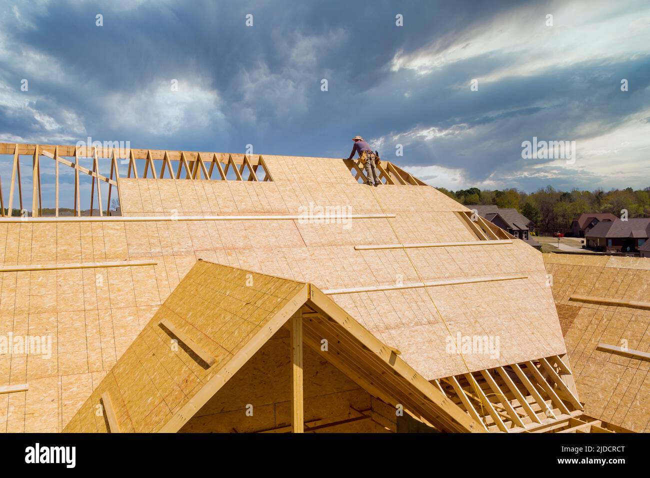 Home roof construction site working on the roof sheeting Stock Photo ...