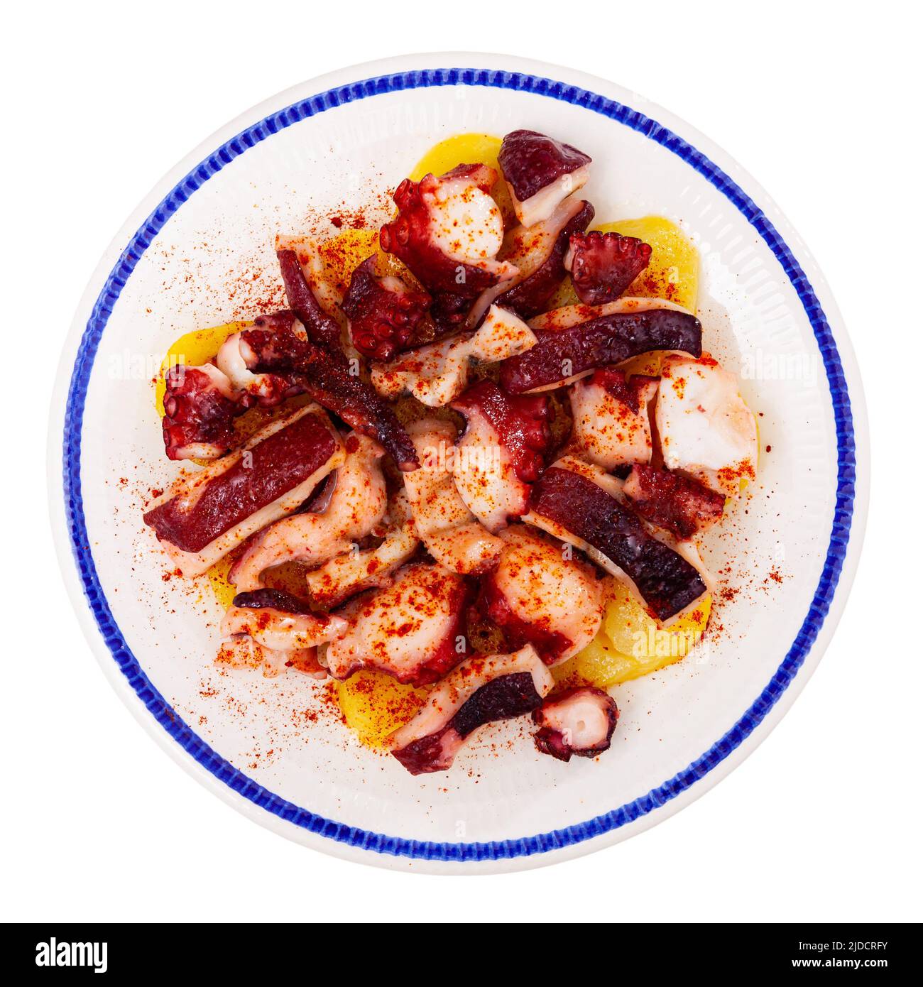 Boiled octopus tentacles with smoked paprika and potatoes Stock Photo ...