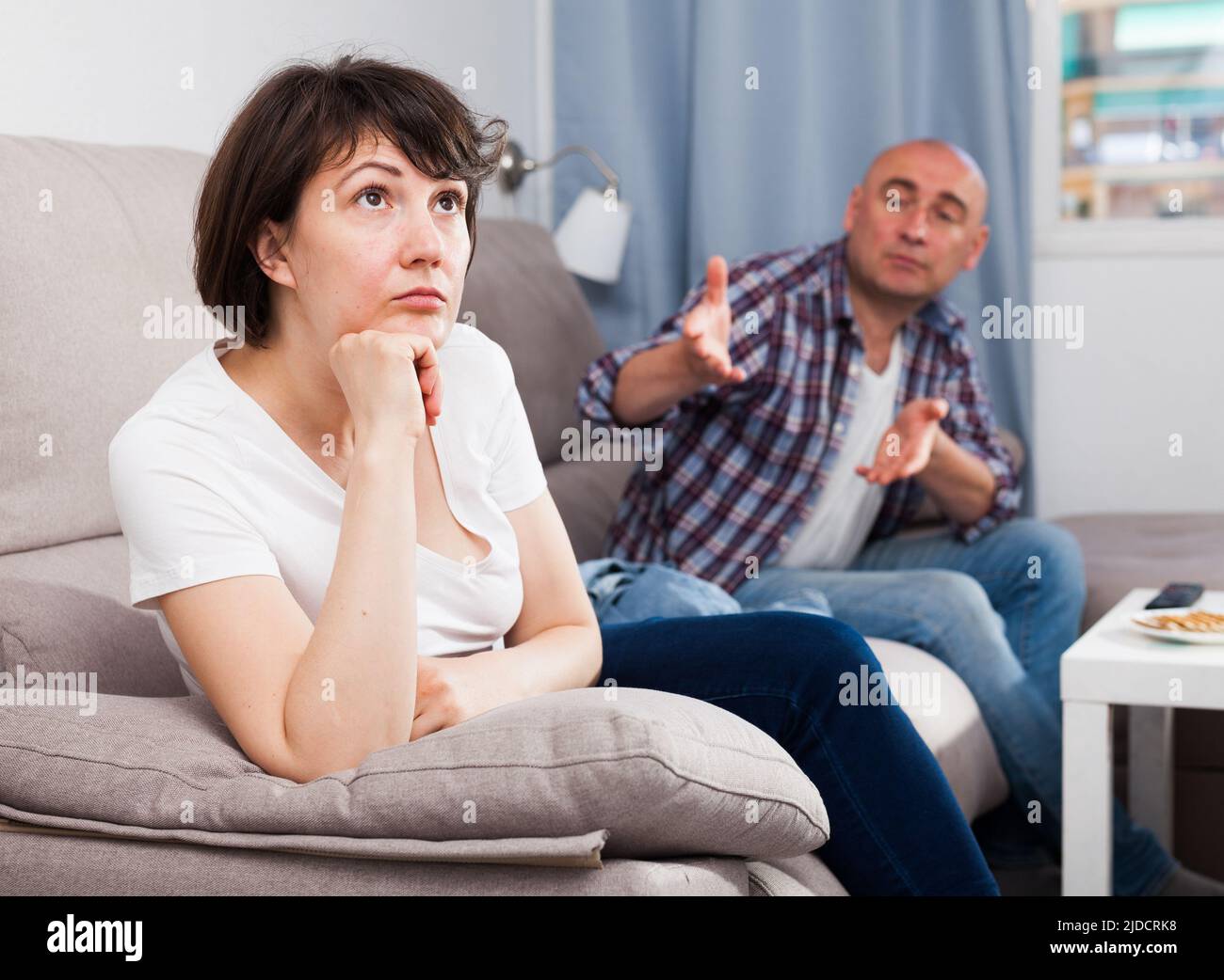 Sad family having difficulties in the living room at home Stock Photo ...