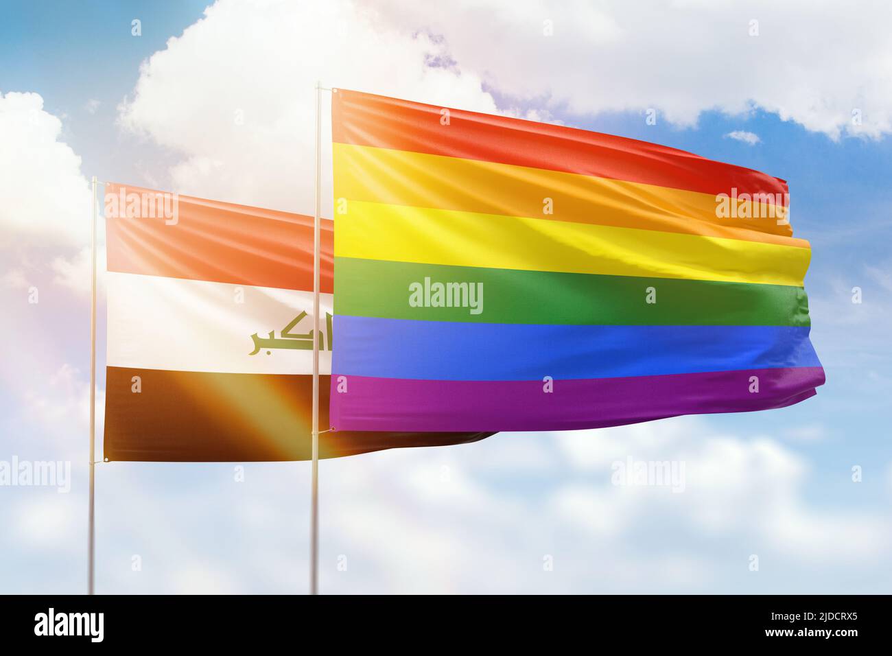 Sunny blue sky and flags of lgbt and iraq Stock Photo - Alamy