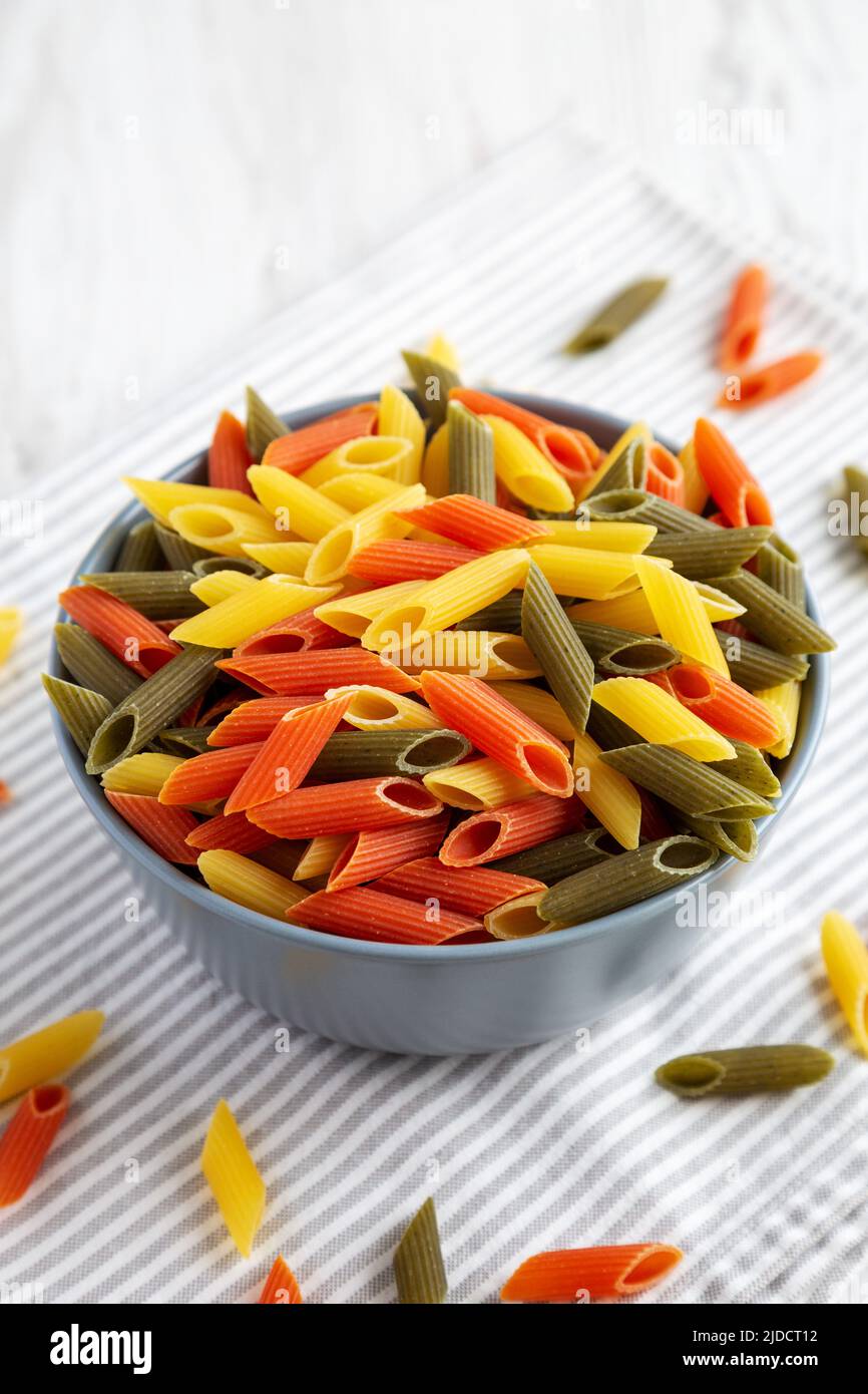 Durum Wheat Semolina Pasta with Tomato and Spinach in a Bowl, side view ...