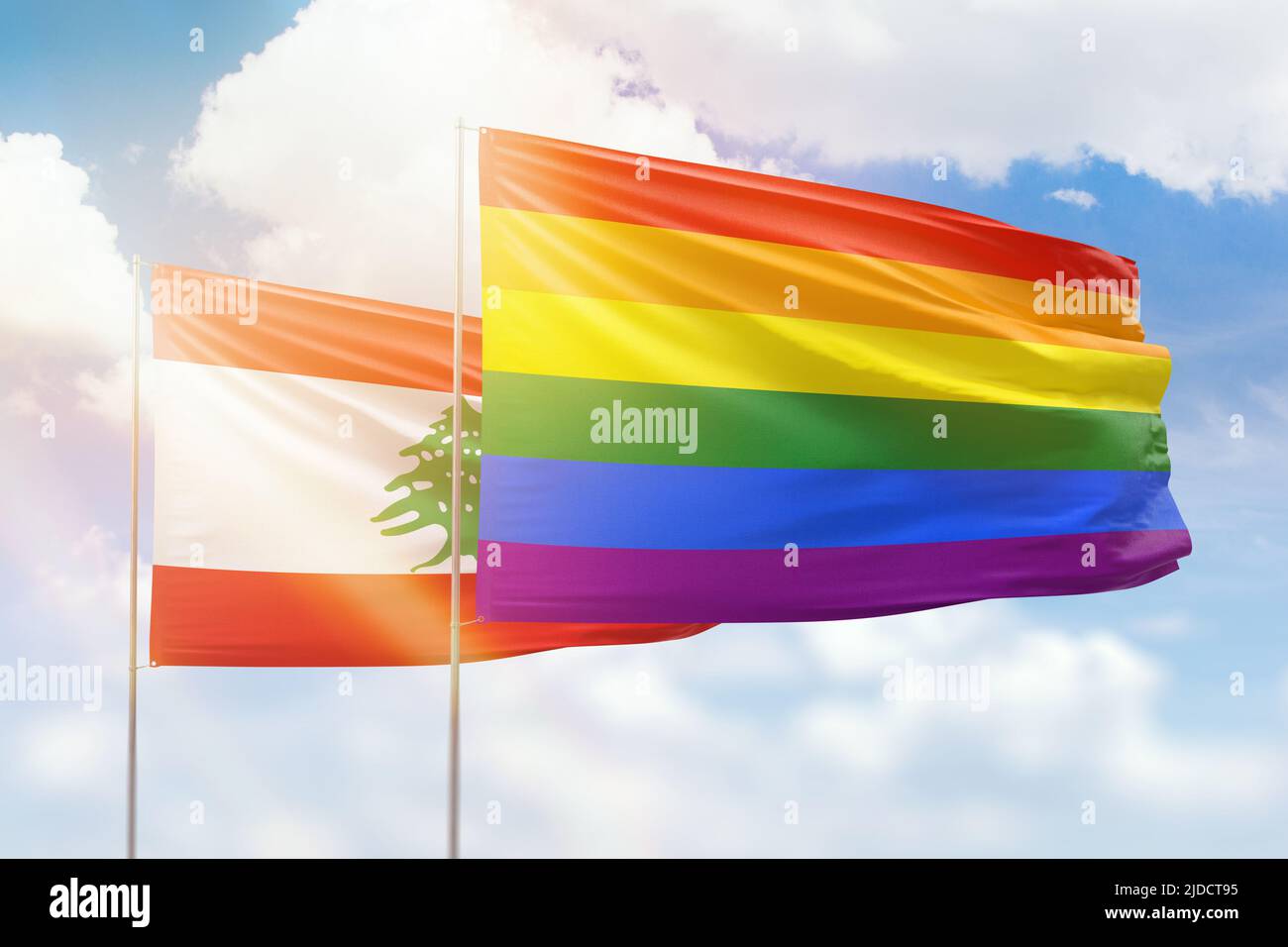 Sunny blue sky and flags of lgbt and lebanon Stock Photo - Alamy