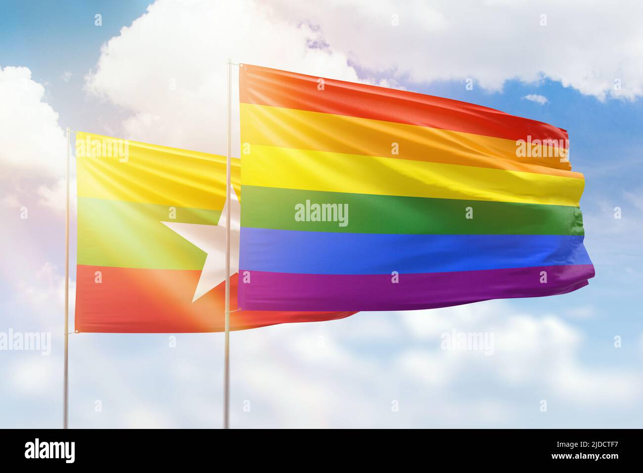 Sunny blue sky and flags of lgbt and myanmar Stock Photo - Alamy