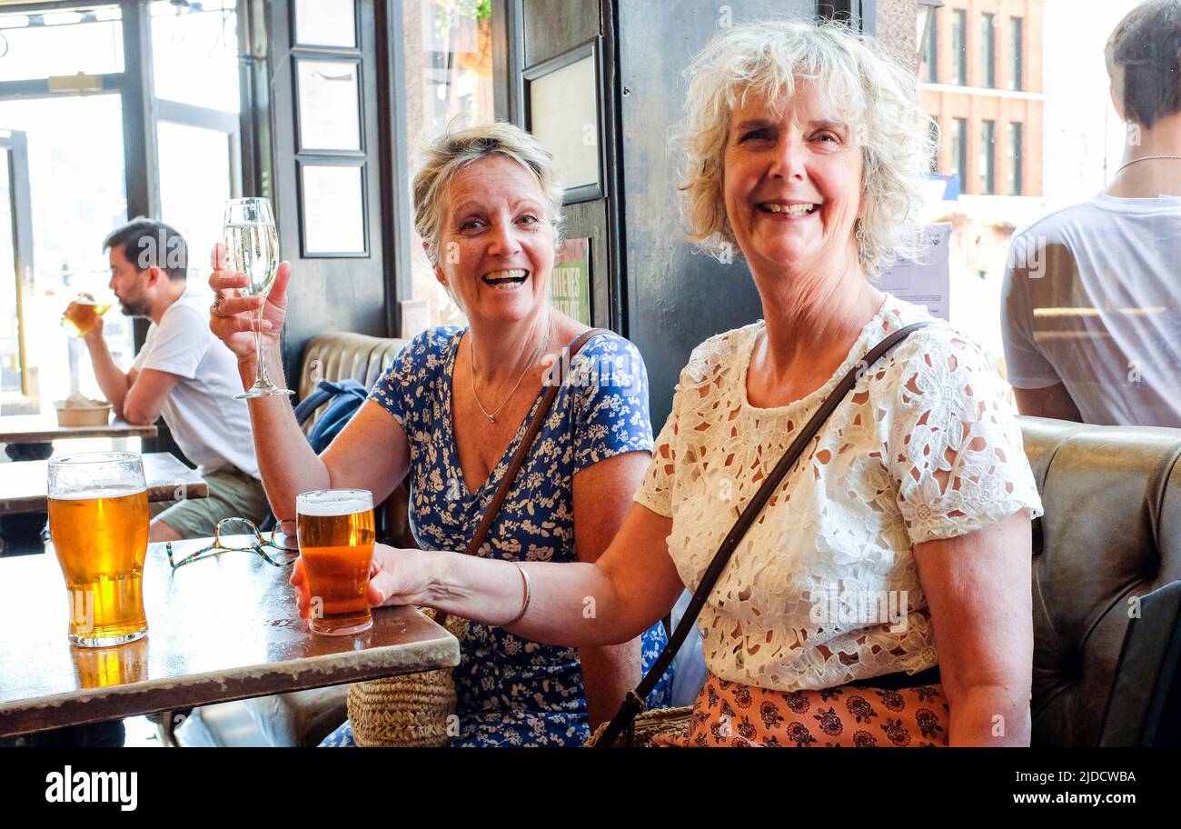 Women drinking in the famous Ten Bells pub Spitafields in the East End ...