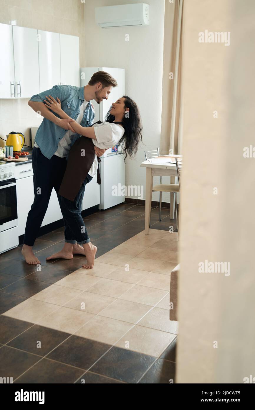 Romantic male and female performing tango at home Stock Photo - Alamy