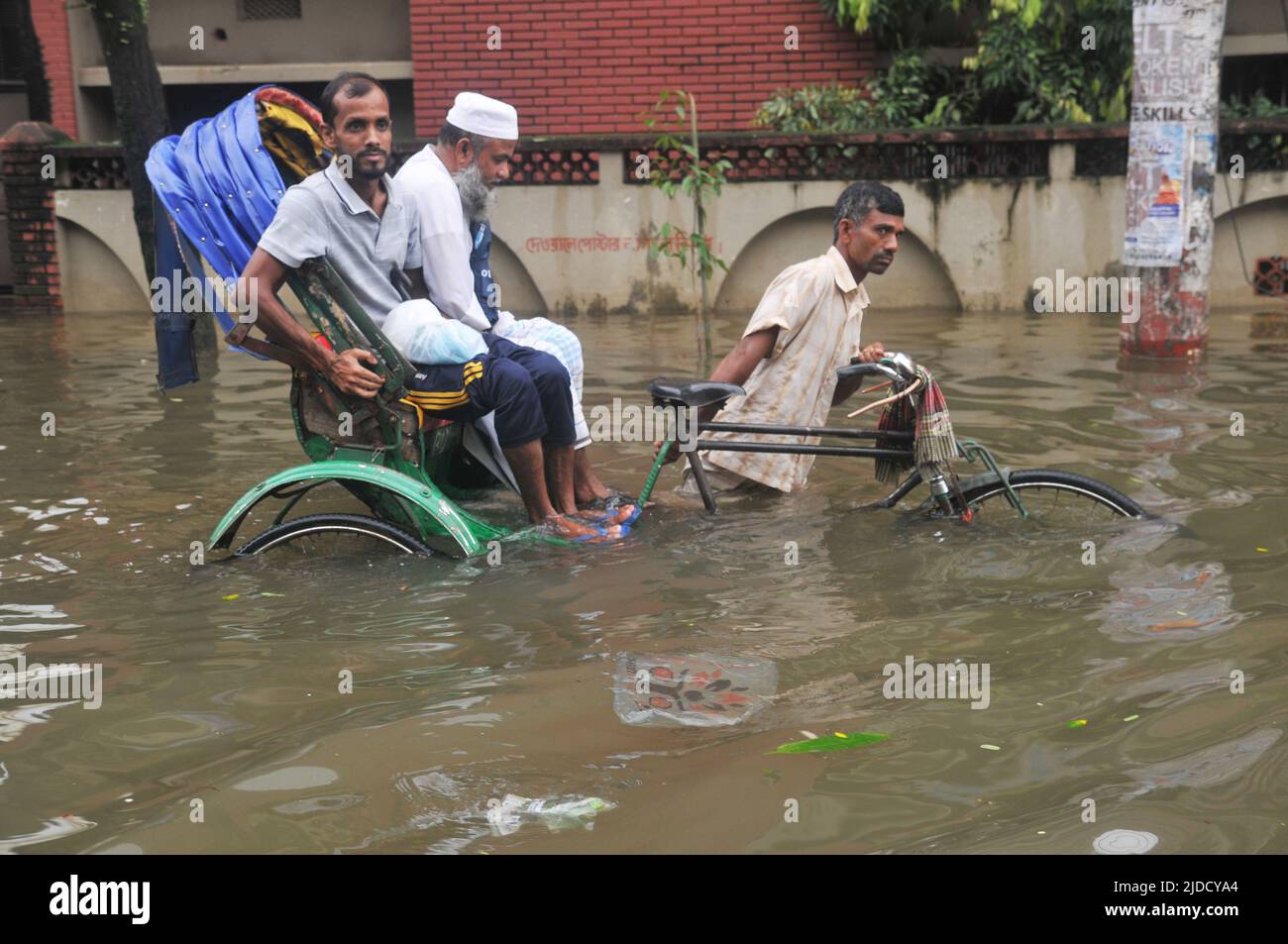 Sylhet, Bangladesh. 20th June 2022. People traveling in rickshaws during floods. The worst ...