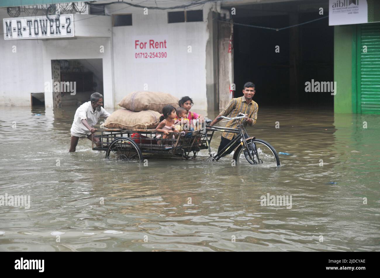 Sylhet, Bangladesh. 20th June 2022. Children traveling in a cart during floods. The worst ...