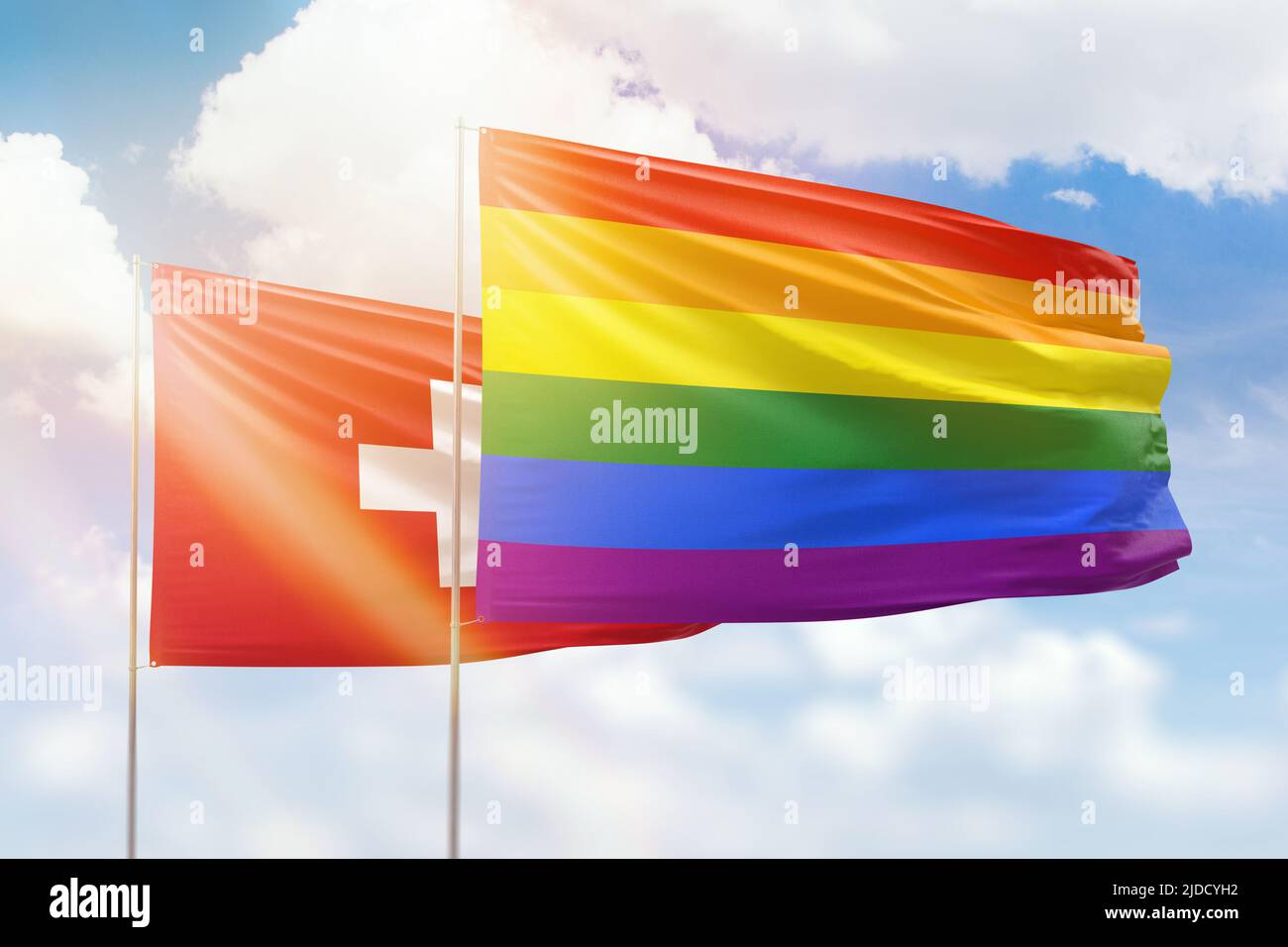 Sunny blue sky and flags of lgbt and switzerland Stock Photo - Alamy