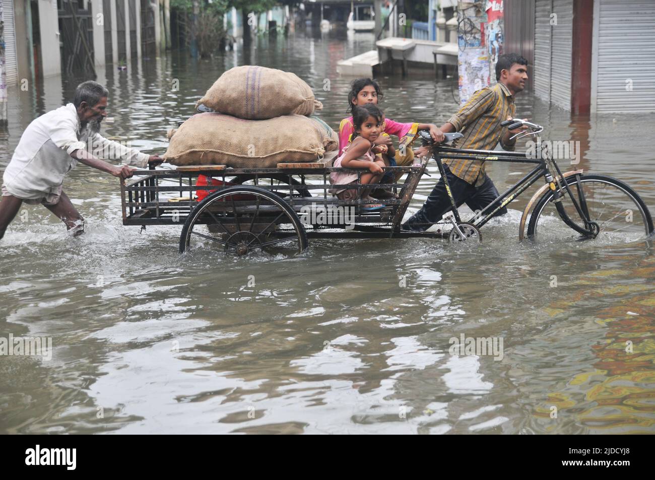 Sylhet, Bangladesh. 20th June 2022. Children traveling in a cart during ...