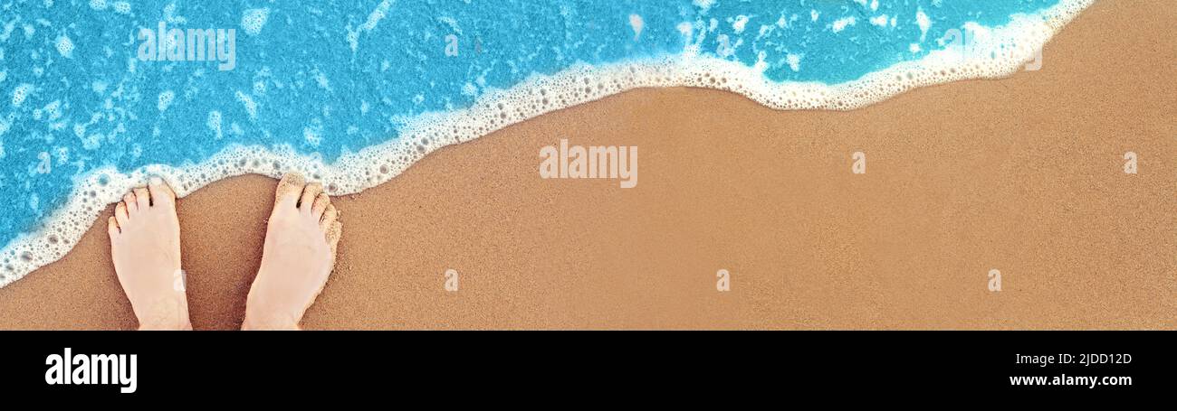 Soft blue ocean wave on clean sandy beach with human feet, top view ...