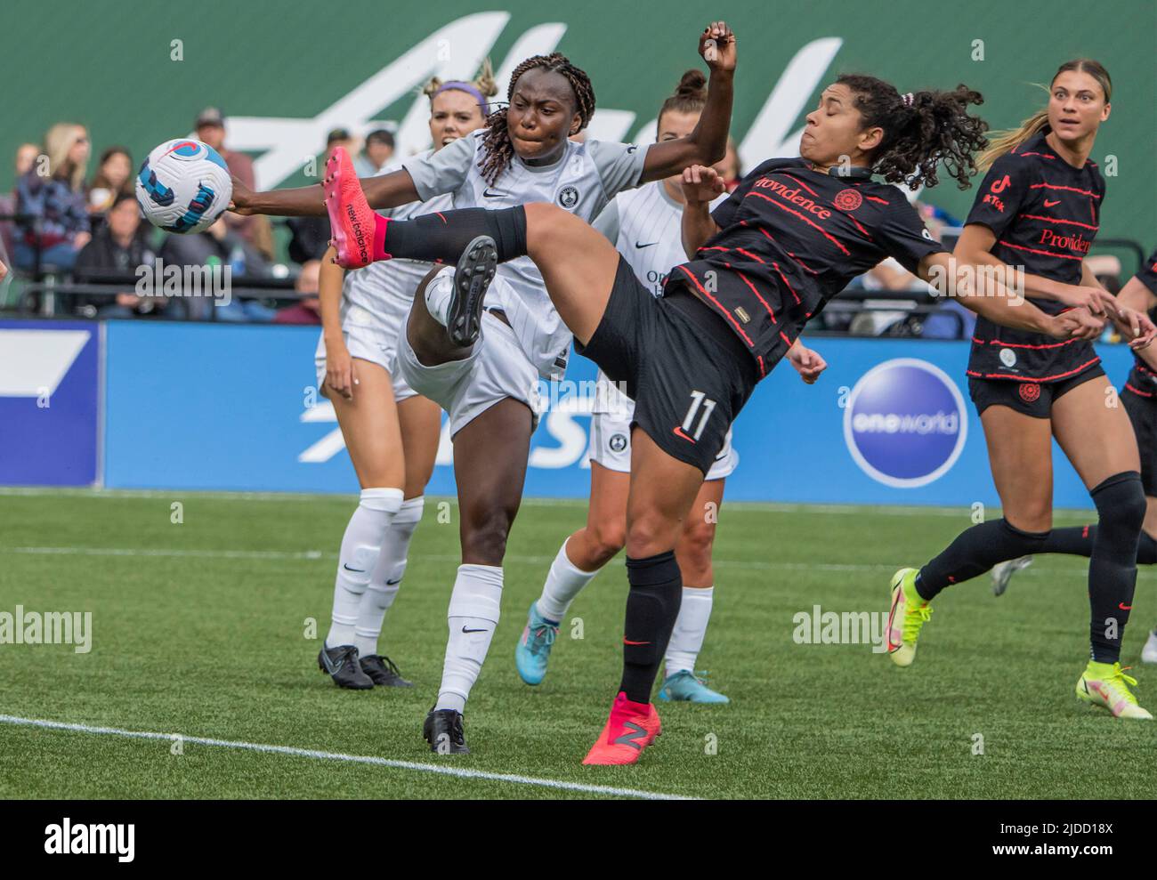 Orlando's Abi Kim and Portland's Rocky Rodriguez compete for the ball ...