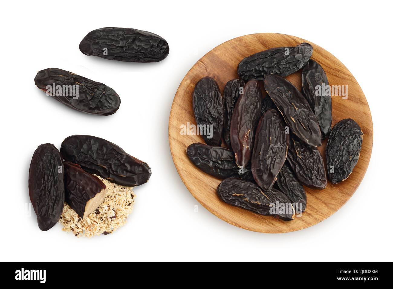 Tonka bean in wooden bowl isolated on white background with full depth ...