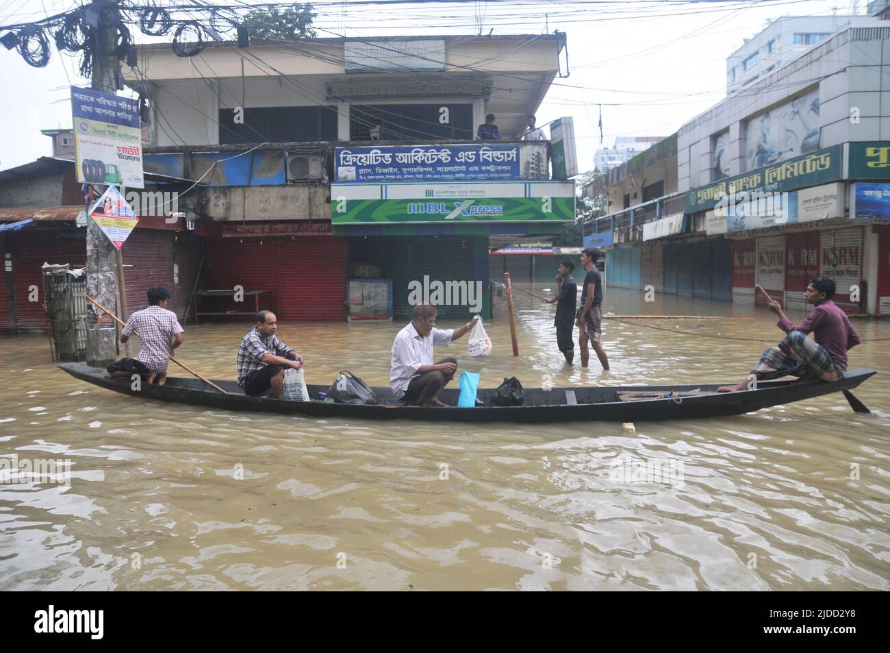 Sylhet, Bangladesh. 20th June 2022. People traveling in a raft during floods. The worst flooding ...