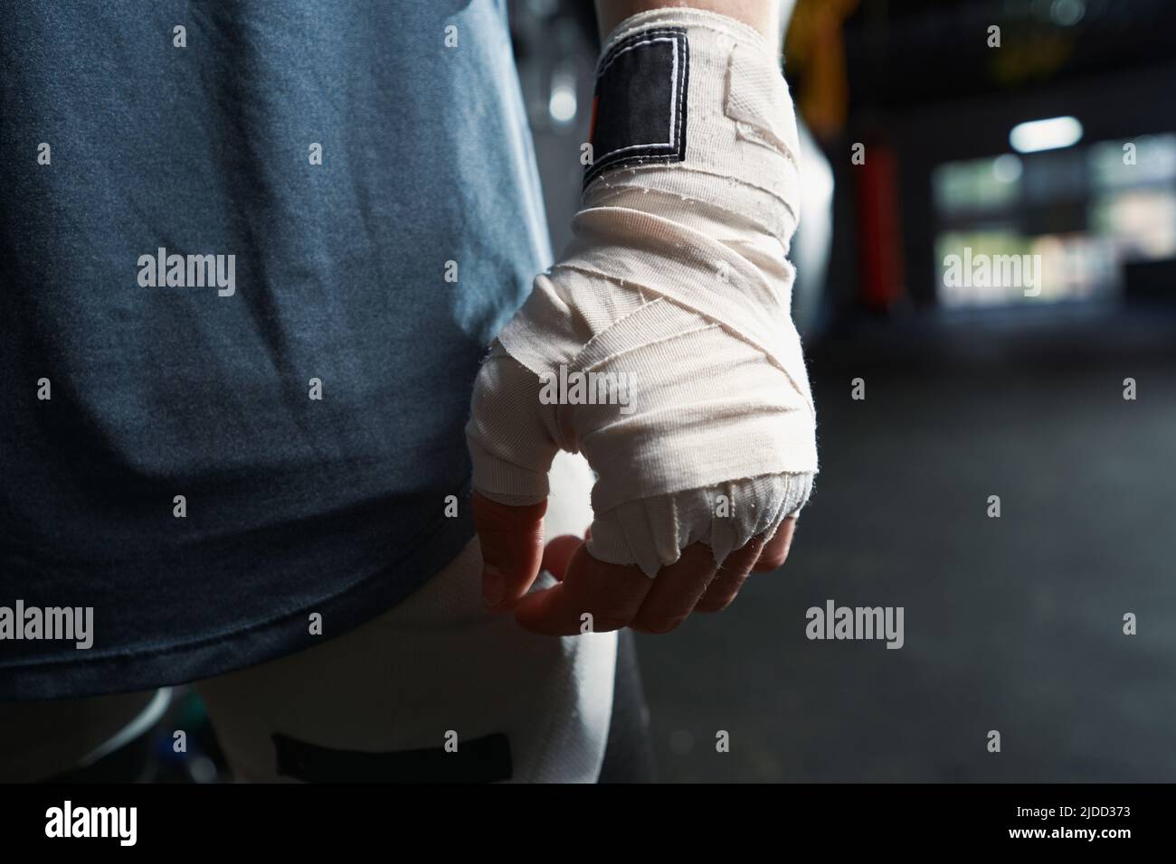 Boxer wearing elastic bandage wrapped around wrist before workout Stock ...
