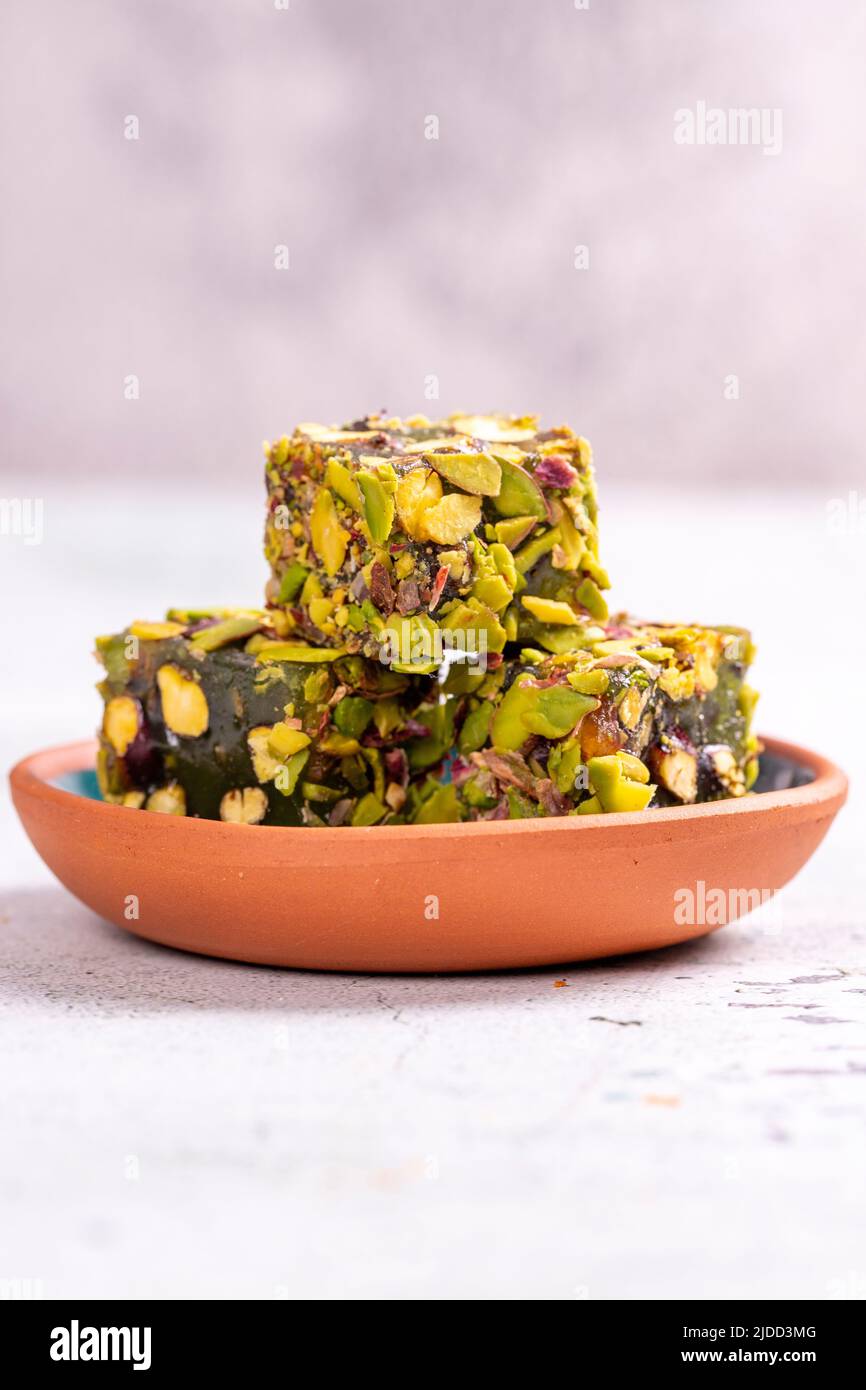Turkish Delight with Pistachio on a stone background. Traditional ...