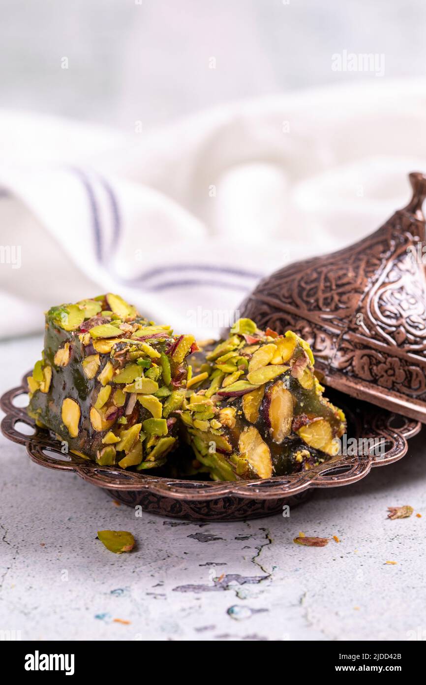 Turkish Delight with Pistachio on a stone background. Traditional Turkish delicacies. Turkish ...