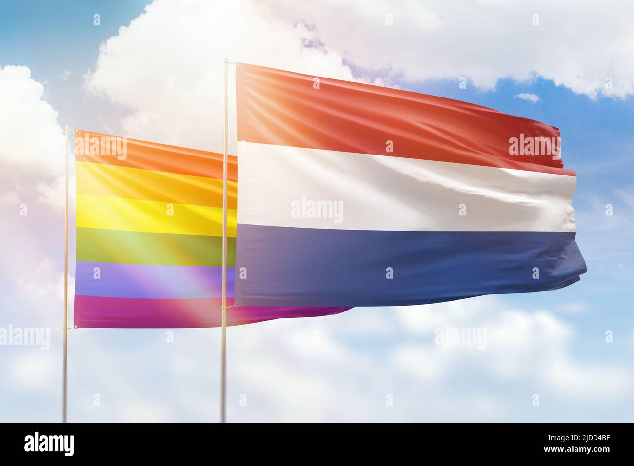 Sunny blue sky and flags of lgbt and netherlands Stock Photo - Alamy