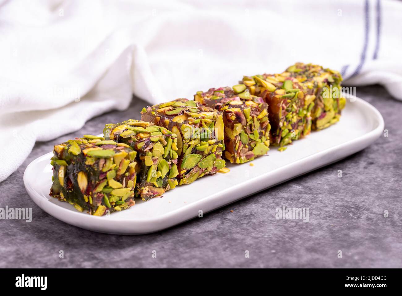 Turkish Delight with Pistachio on a dark background. Traditional ...