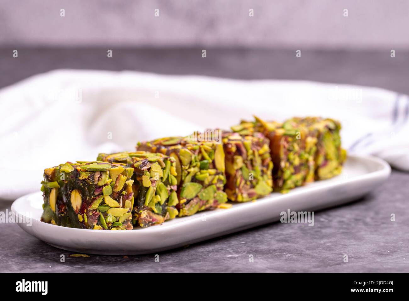 Turkish Delight with Pistachio on a dark background. Traditional ...
