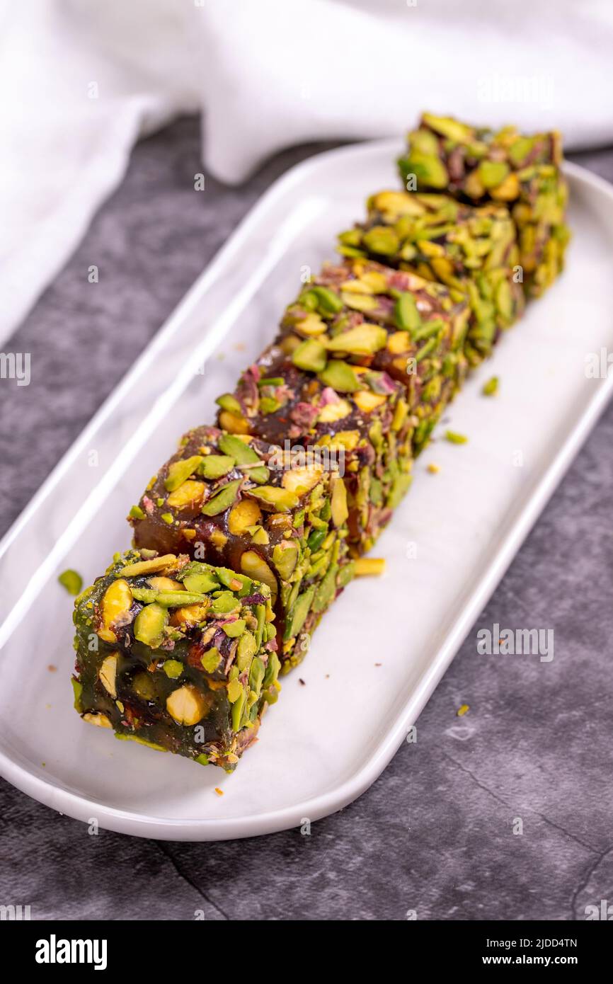 Turkish Delight with Pistachio on a dark background. Traditional ...