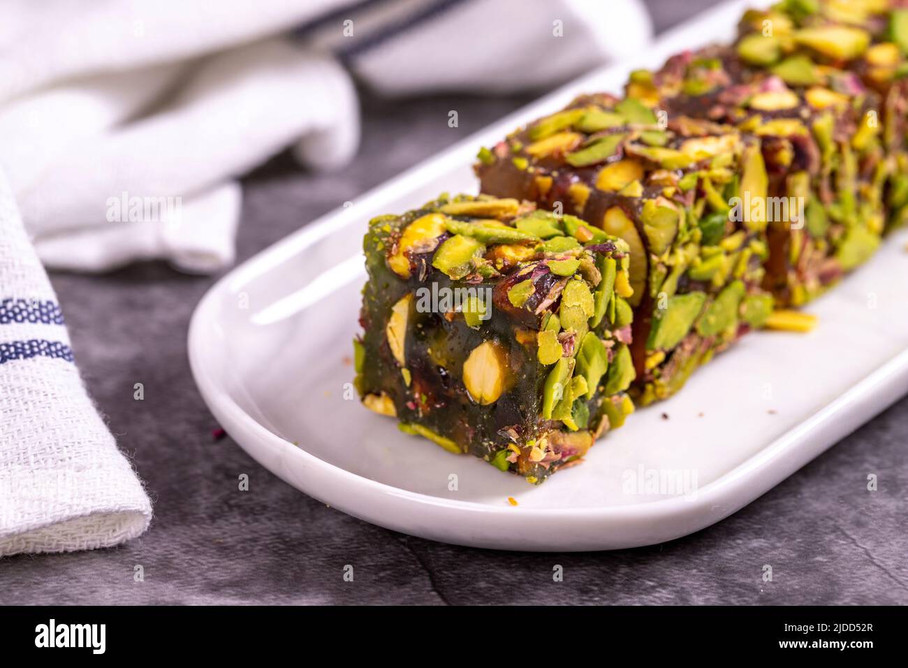 Turkish Delight with Pistachio on a dark background. Traditional ...
