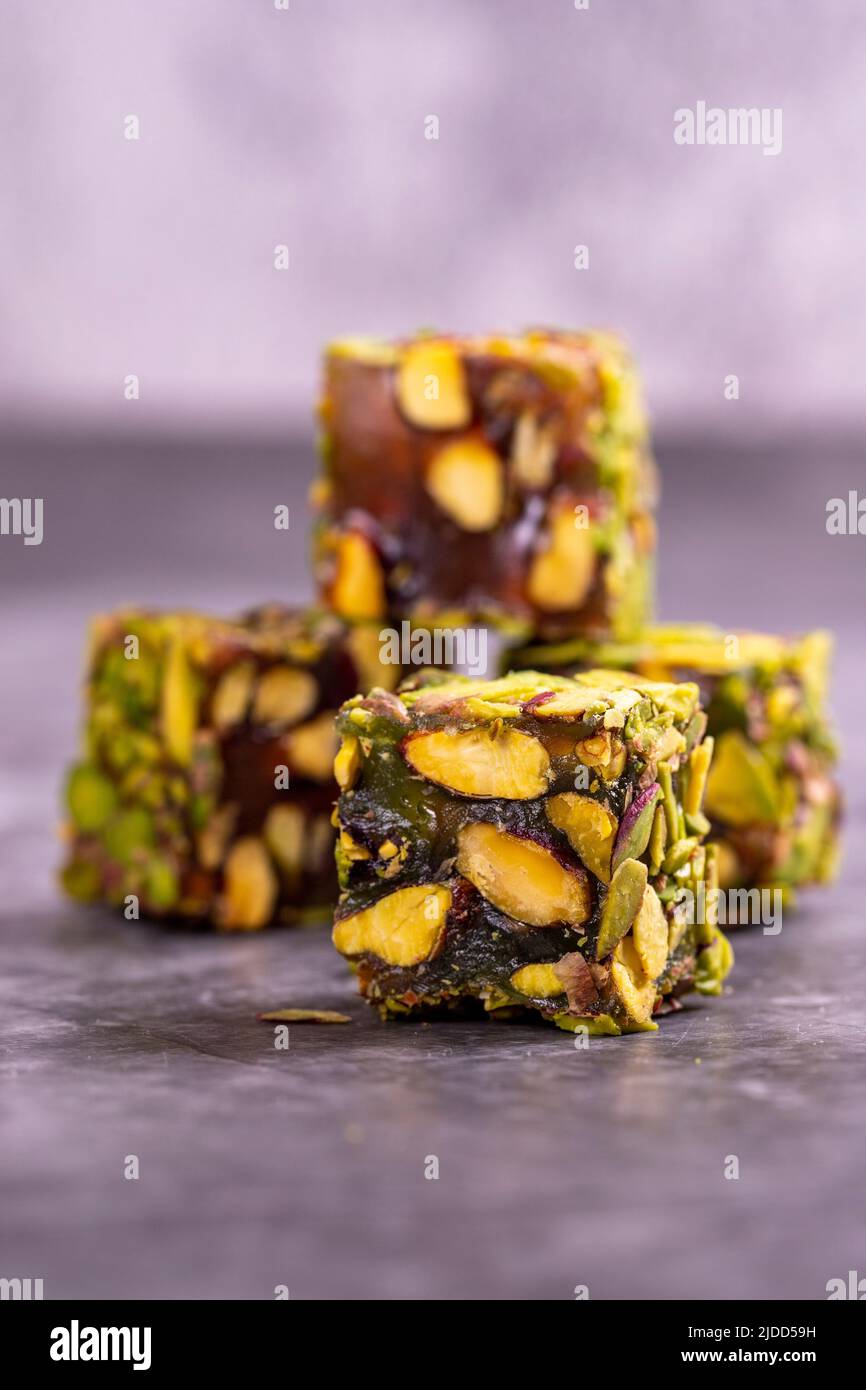 Turkish Delight with Pistachio on a dark background. Traditional ...