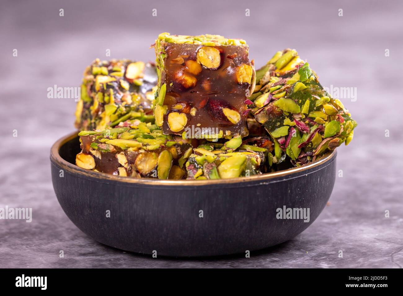 Turkish Delight with Pistachio on a dark background. Traditional ...