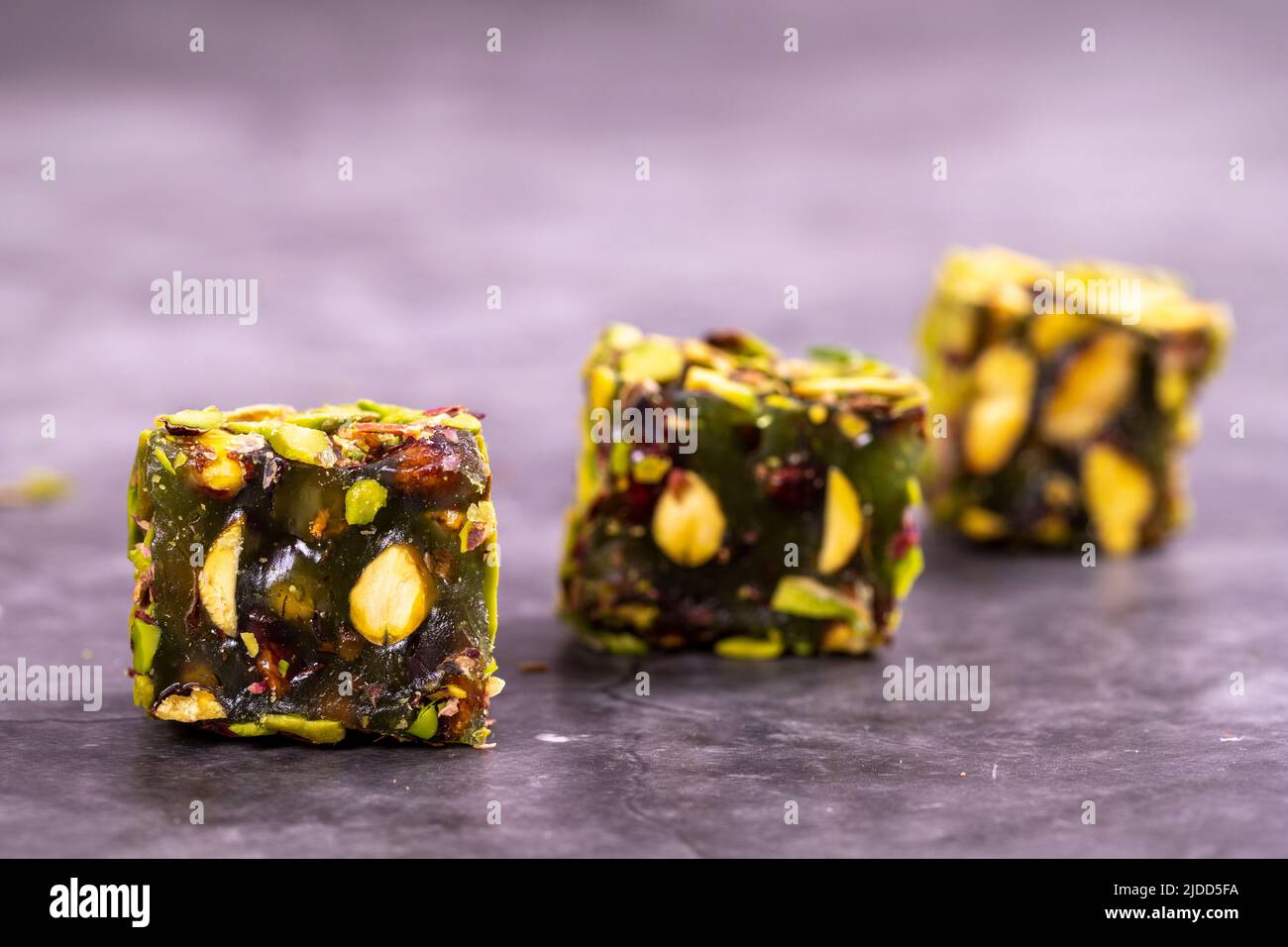 Turkish Delight with Pistachio on a dark background. Traditional ...