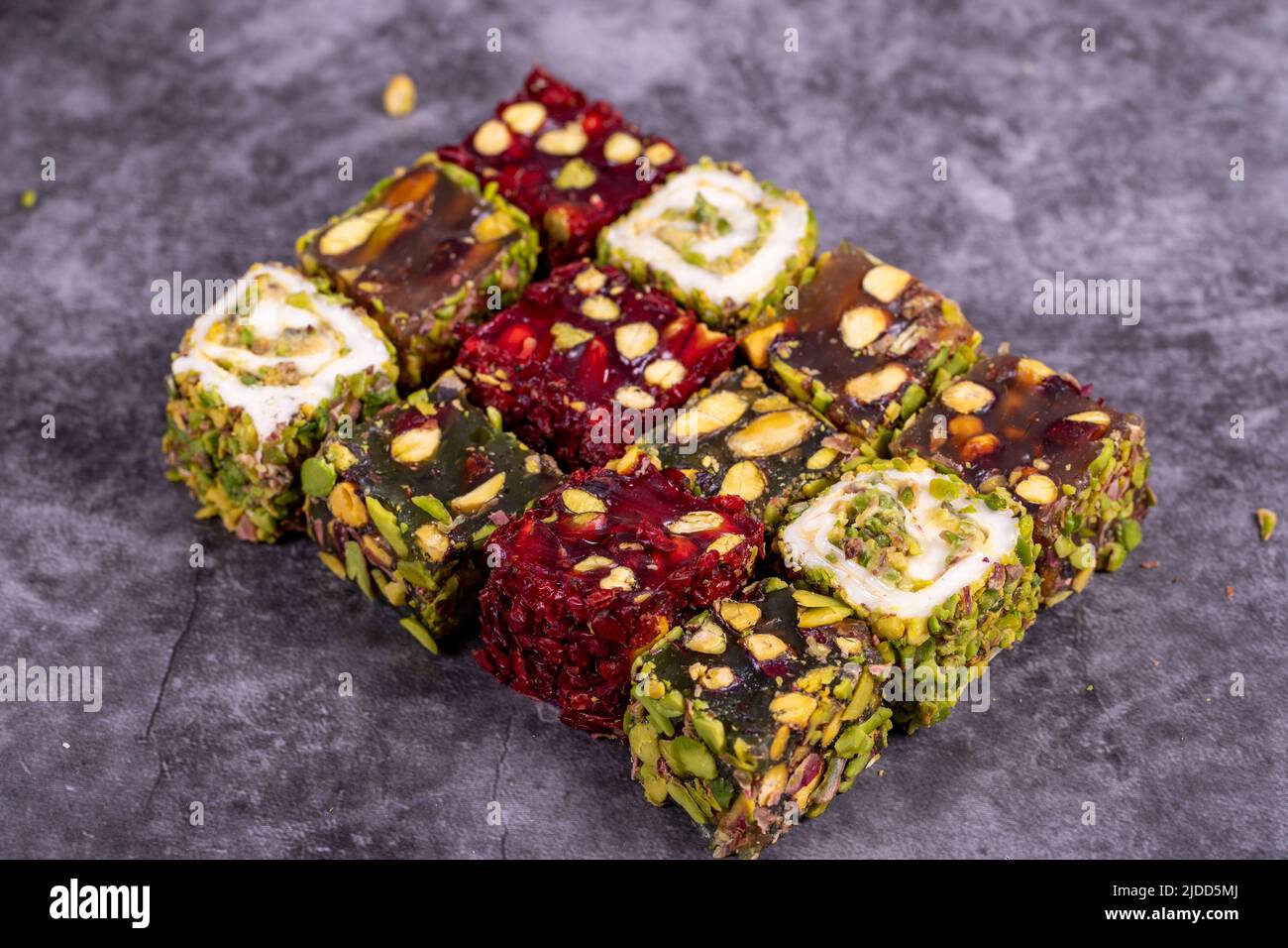 Turkish delight on a dark background. Traditional Turkish delicacies ...