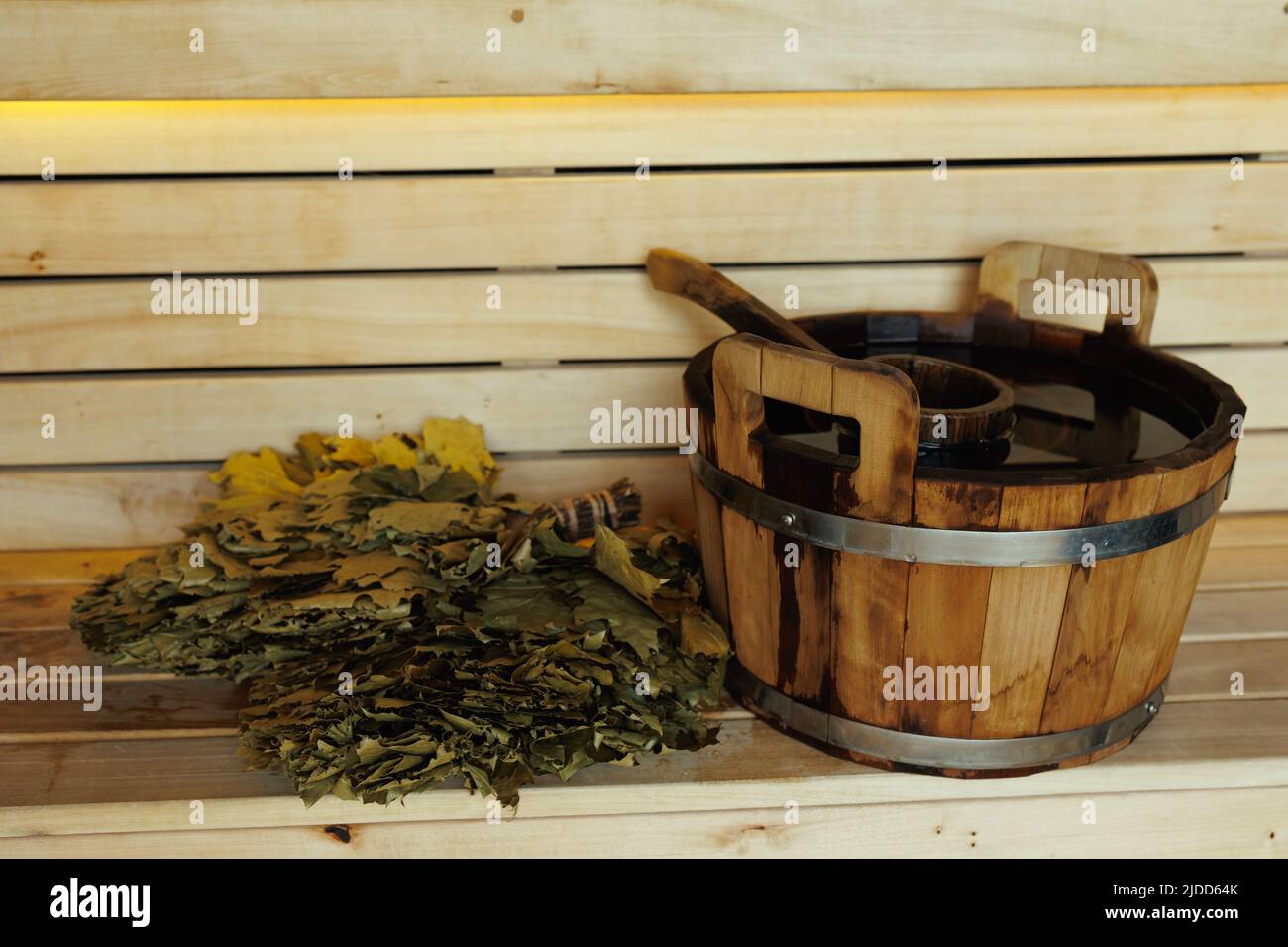 Sauna accessories, bucket, ladle and broom for sauna on wooden planks ...