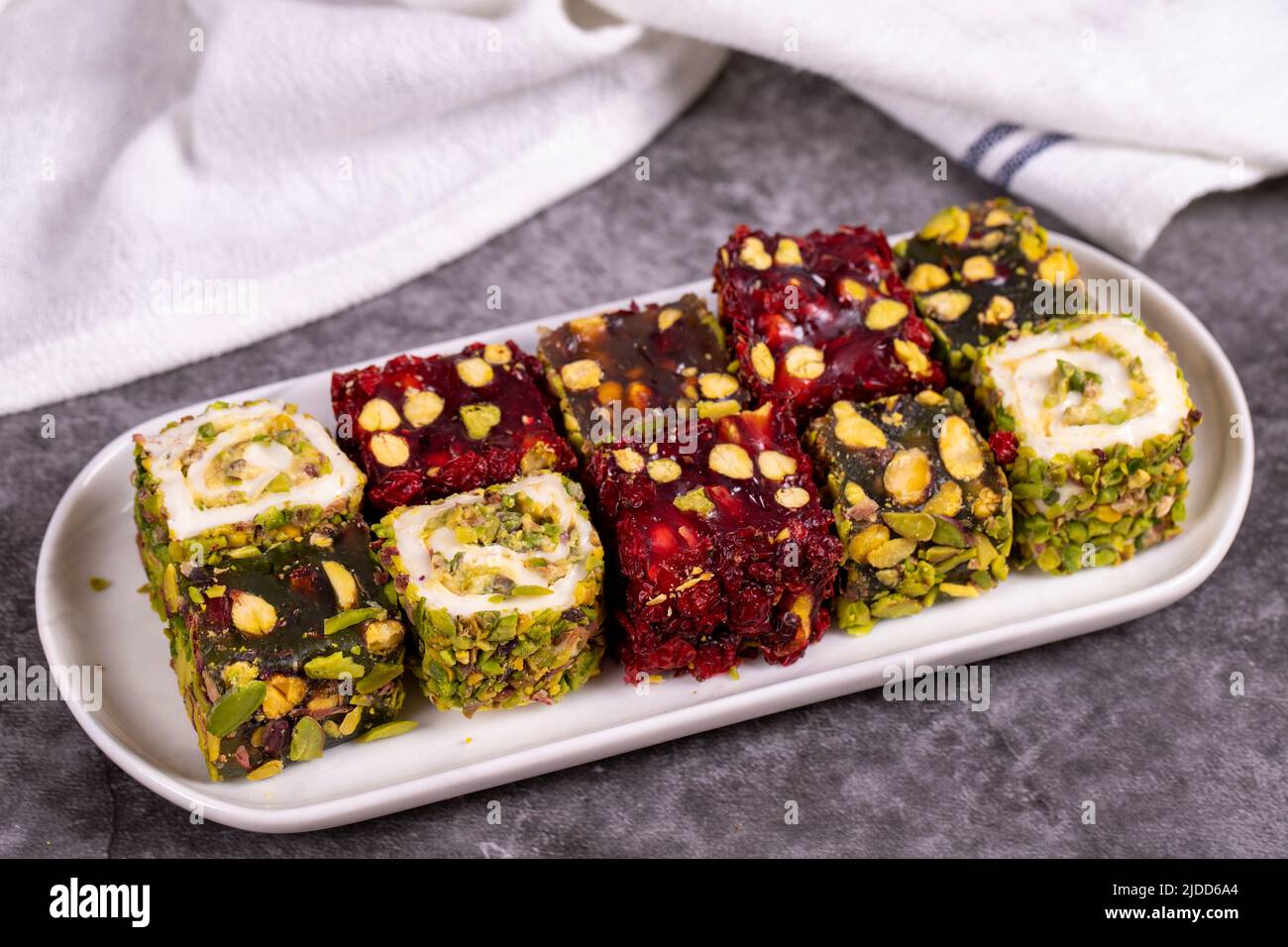 Turkish delight on a dark background. Traditional Turkish delicacies ...