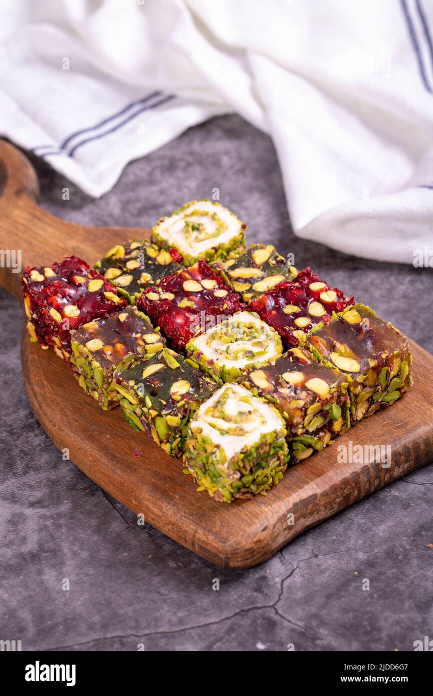 Turkish delight on a dark background. Traditional Turkish delicacies ...