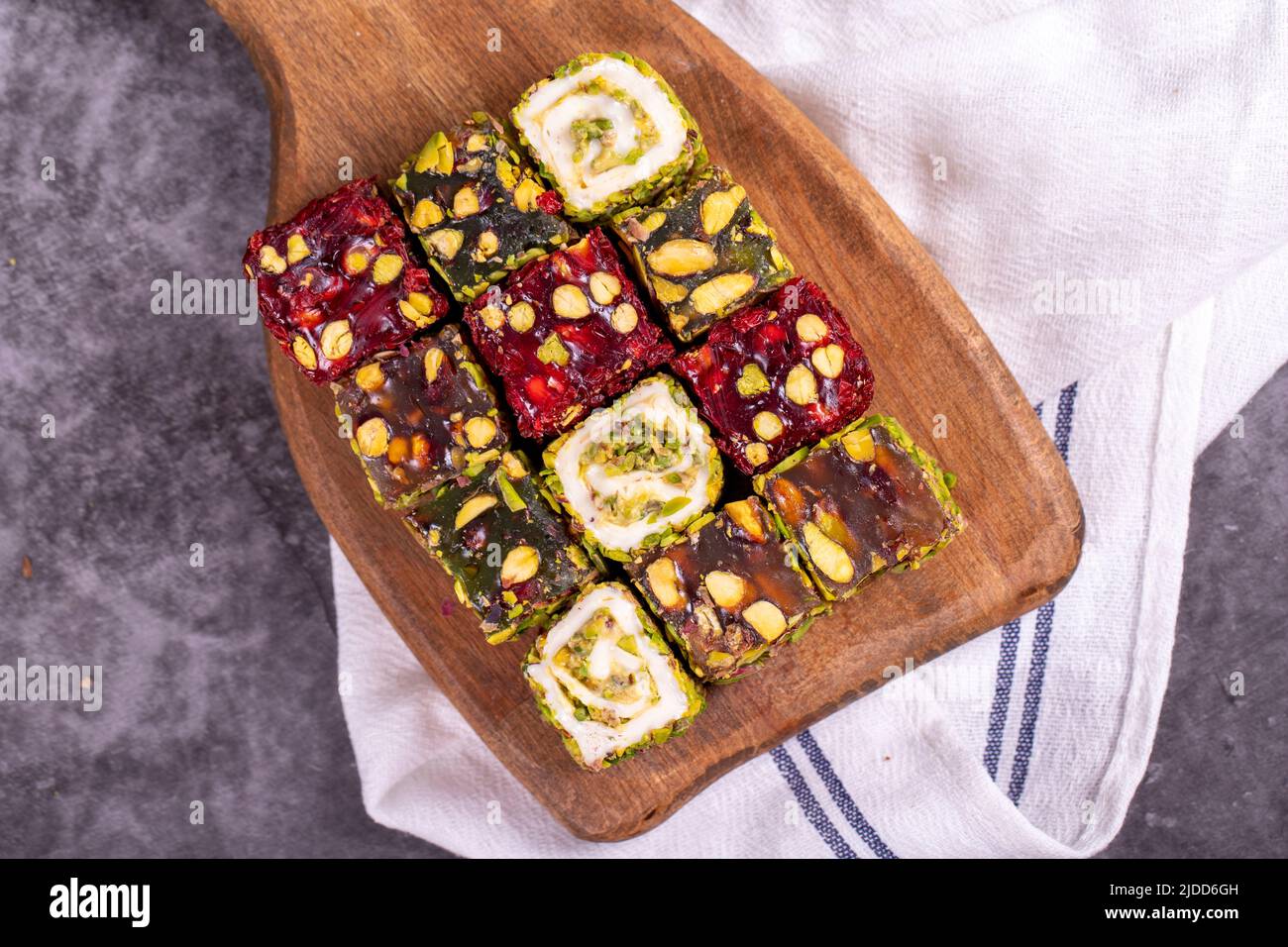 Turkish delight on a dark background. Traditional Turkish delicacies ...
