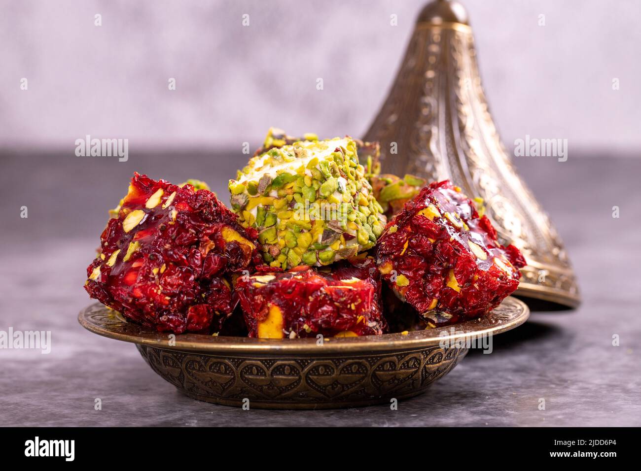 Turkish delight on a dark background. Traditional Turkish delicacies ...
