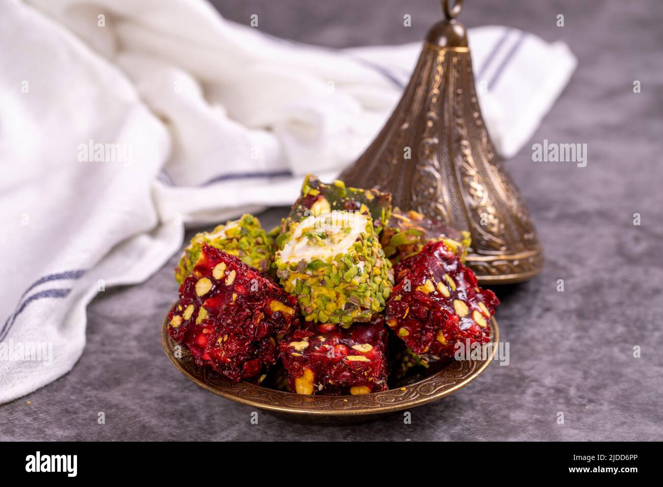 Turkish delight on a dark background. Traditional Turkish delicacies ...