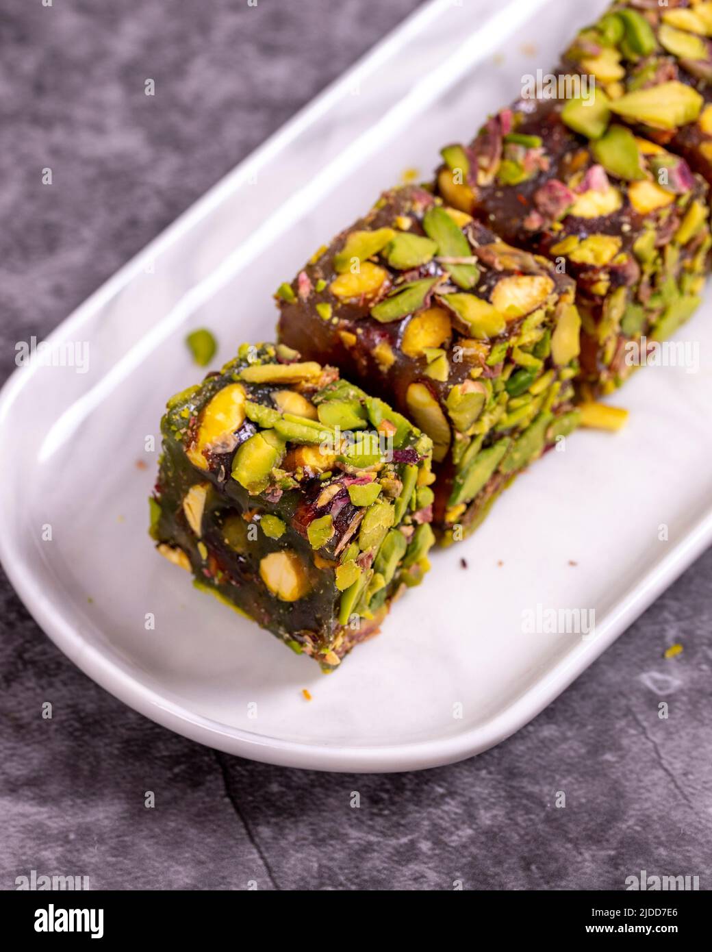 Turkish Delight with Pistachio on a dark background. Traditional Turkish delicacies. Turkish ...