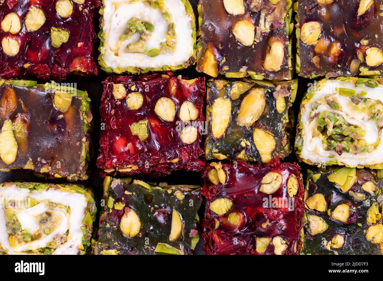 Turkish delight on a dark background. Traditional Turkish delicacies ...