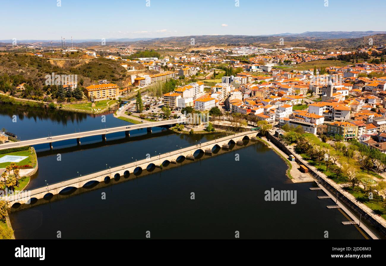 Aerial view of Mirandela city with bridges crossing Tua river, Portugal ...