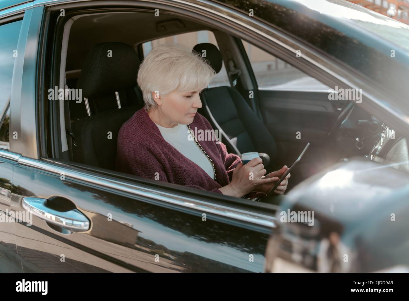 Female passenger seated alone in the automobile Stock Photo - Alamy