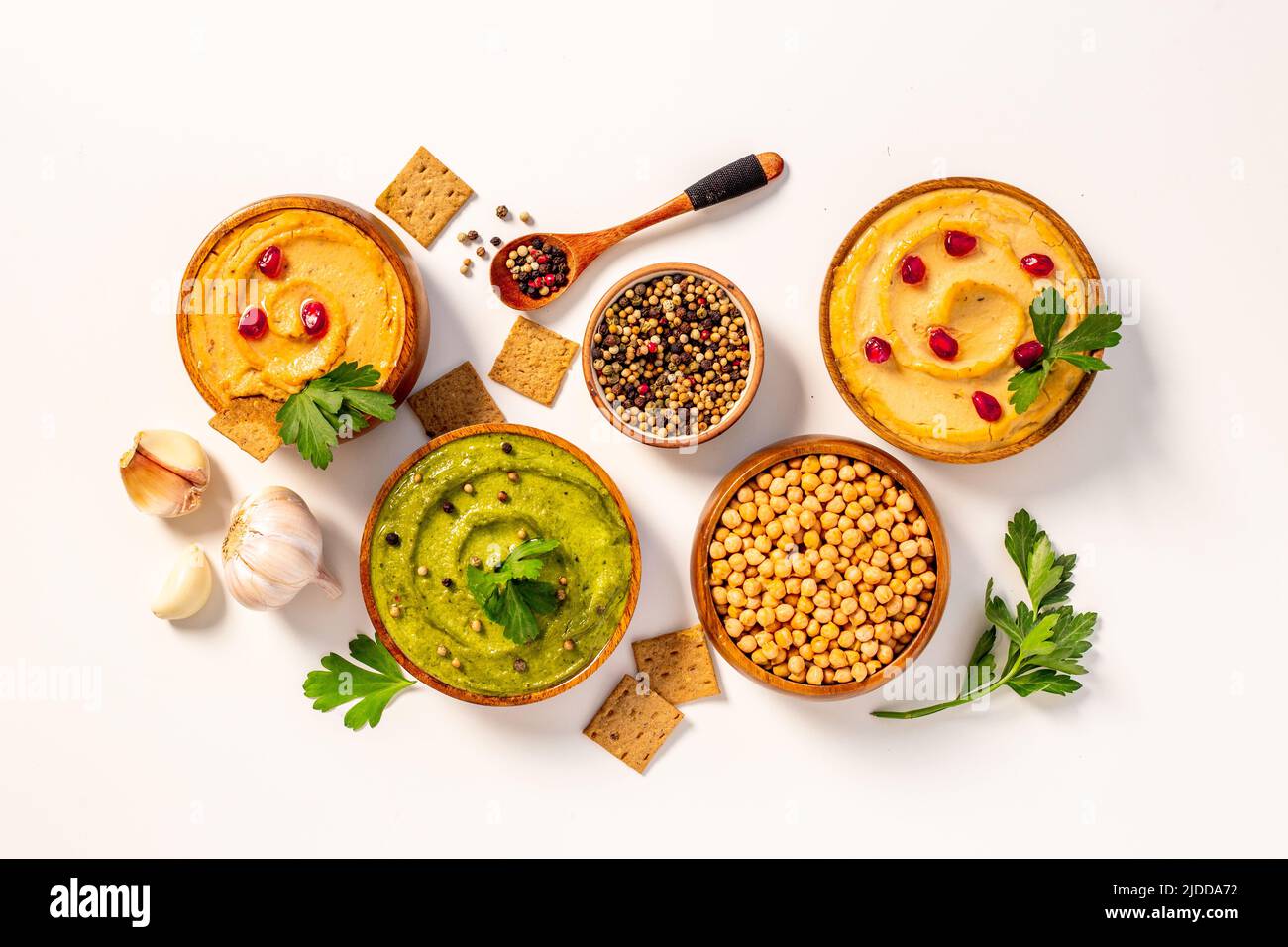 Flatlay of different types of colorful hummus in bowls. Vegan food ...
